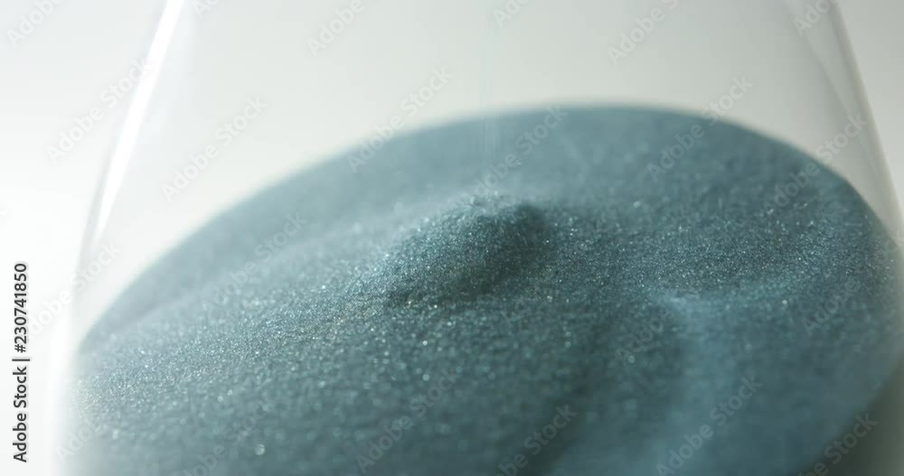 camera rotates slowly around the lower part of hour glass, showing the ...