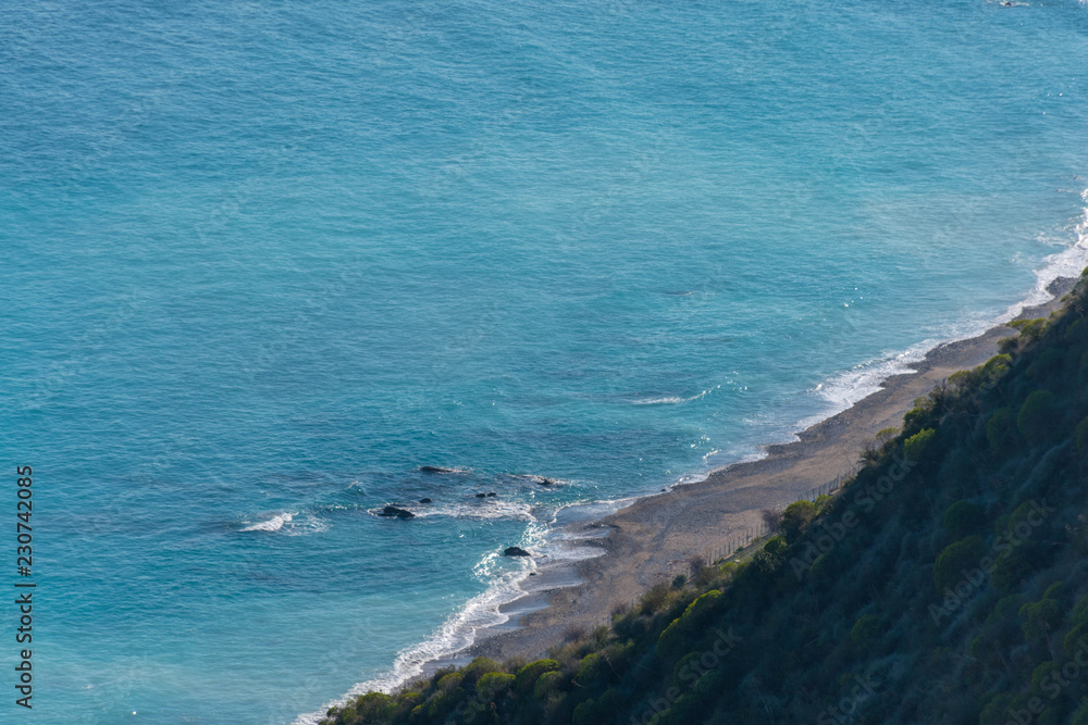 Bird's eye view of a shoreline and a blue ocean in Sicily, Italy ...