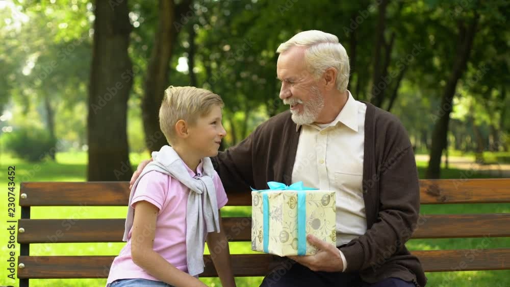Grandson gives birthday present to grandfather, love and attention to ...