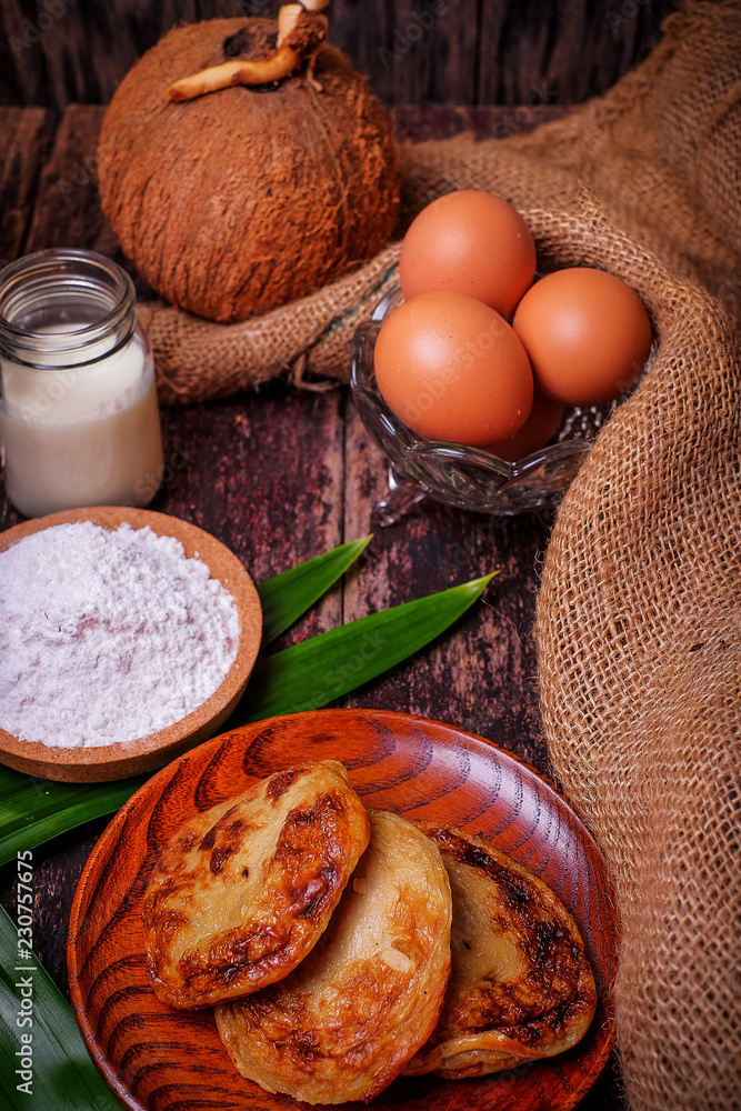 Akok Kedut, egg, coconut, flour , coconut milk and Pandan leaf on ...