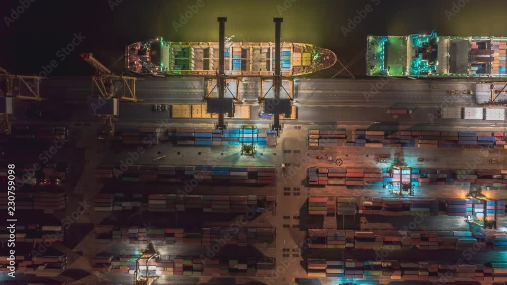 Aerial view time lapse over industrial import or export port of ...