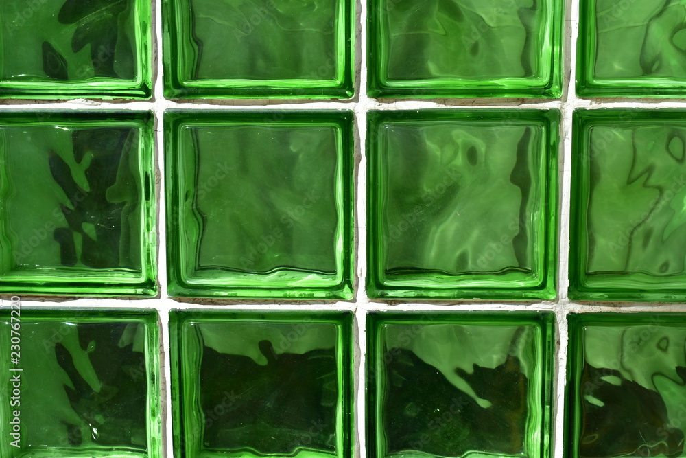 Green glass bricks background. Shiny green glass texture with sun light ...