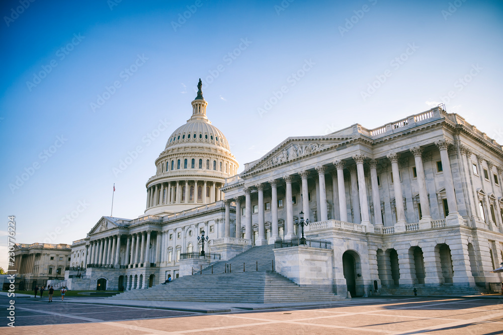 Bright mid-day view of the traditional neoclassical architecture of the ...