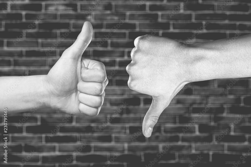 Two hands showing different gestures. Thumb up and thumb down Stock ...