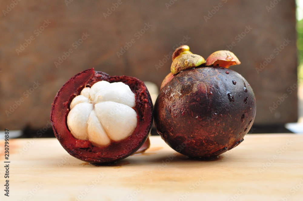 Mangosteen fruit, cross section showing the thick purple skin, queen of ...
