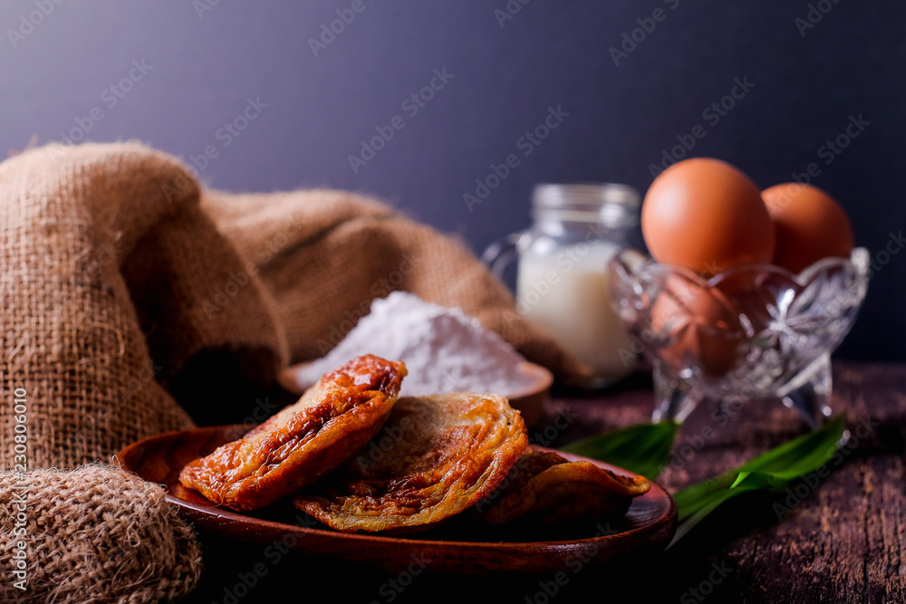 Akok Kedut, egg, coconut, flour , coconut milk and Pandan leaf on ...