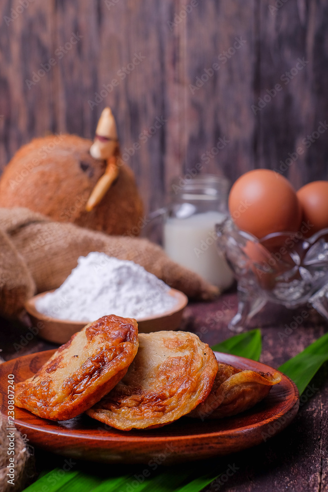 Akok Kedut, egg, coconut, flour , coconut milk and Pandan leaf on ...