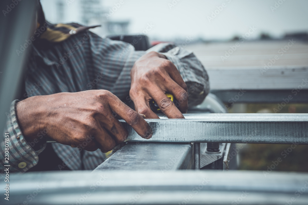 engineer and electrician installing solar power plant; scope of work at ...