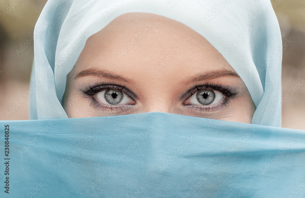 Pretty girl with beautiful big blue eyes, big eyelashes and eyebrows ...