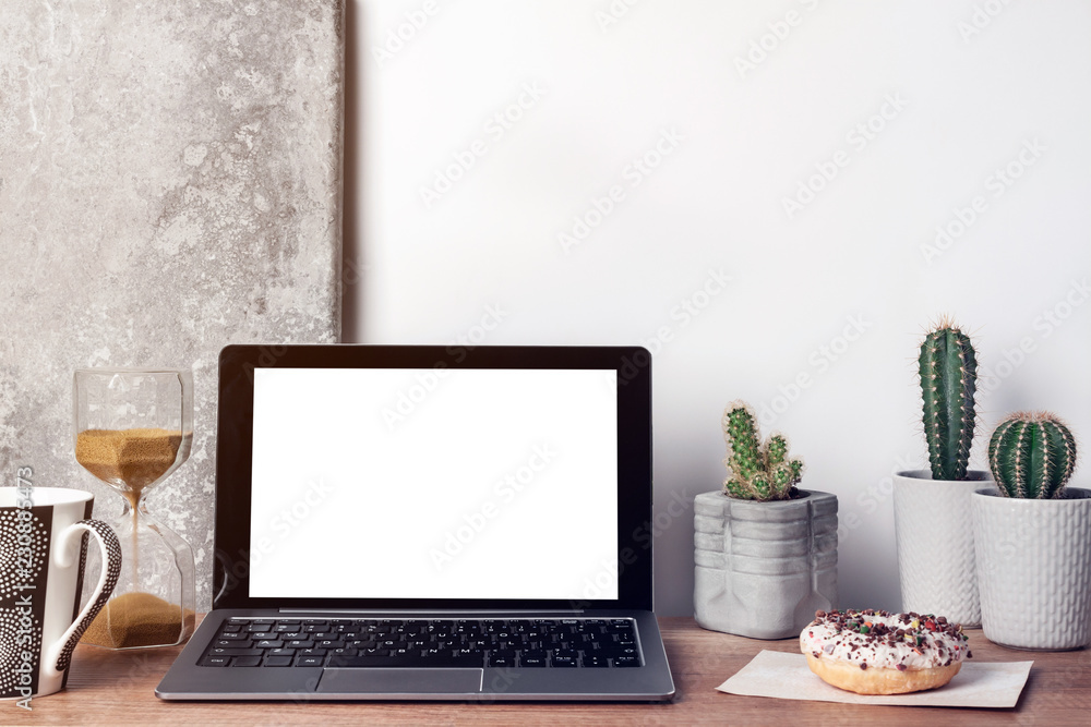 Hipster desk with laptop mockup, cup of coffee, hourglass, donut ...