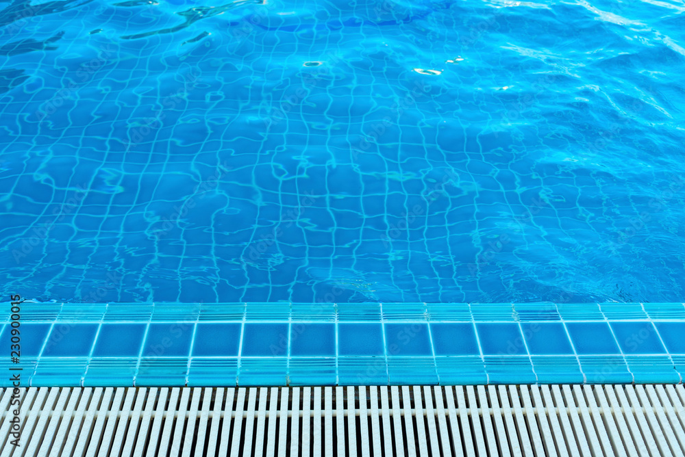 Overflow grating of swimming water pool. Stock Photo | Adobe Stock