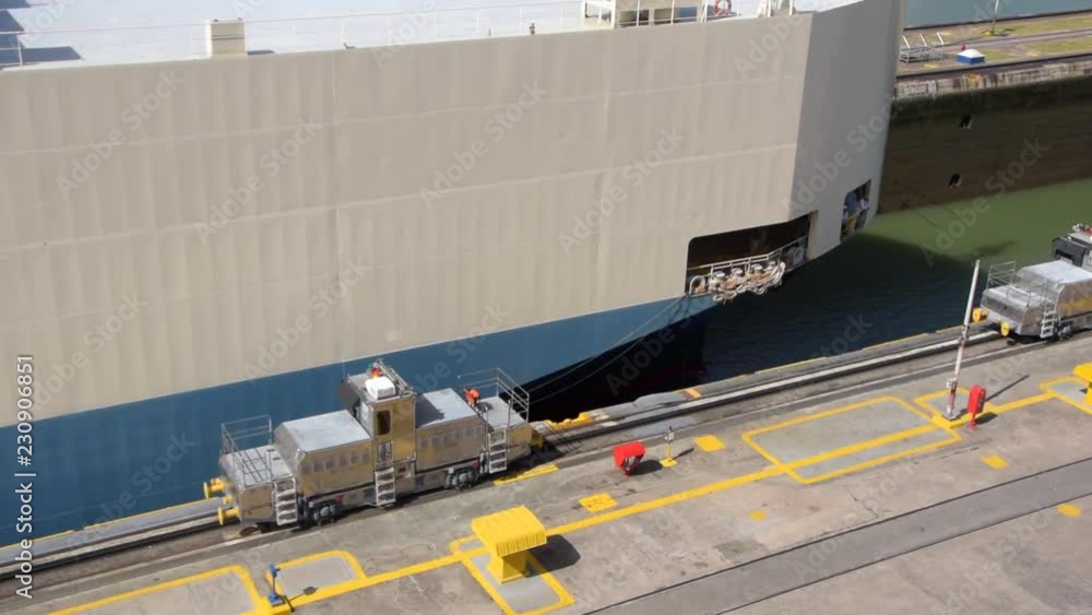 A huge cargo ship transporting cars just crossing one of the gates at ...