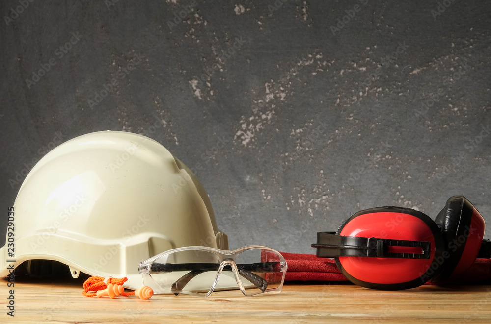 Safety Personal Protective Equipment(PPE) on a rustic black background ...