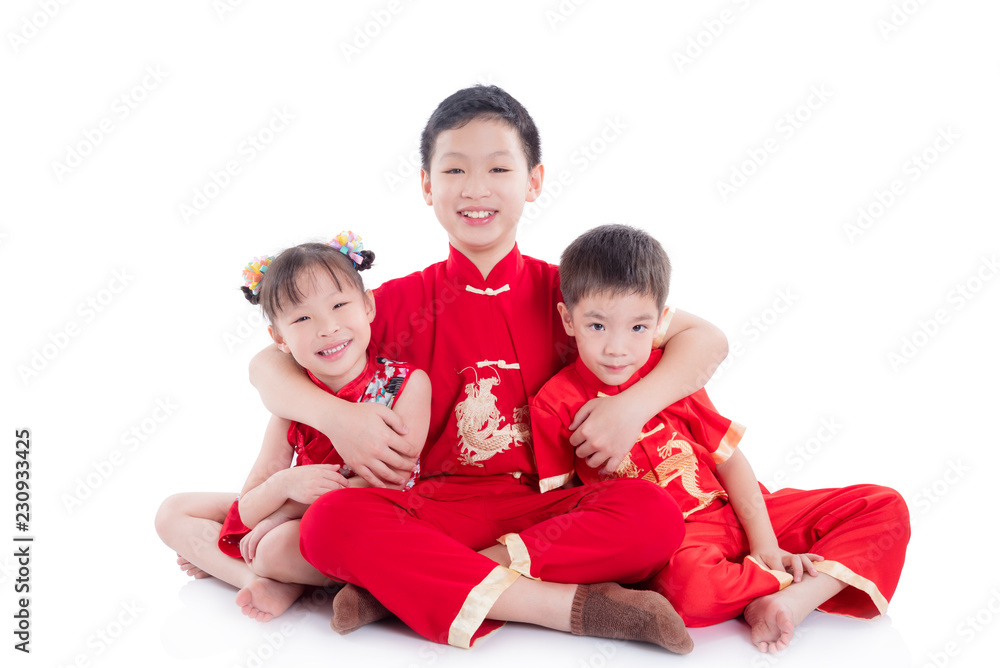 Group of chinese children wearing traditional costume sitting and smile ...