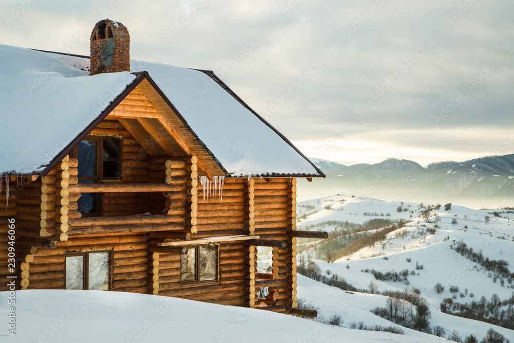 house in the snowy mountains Stock Photo | Adobe Stock