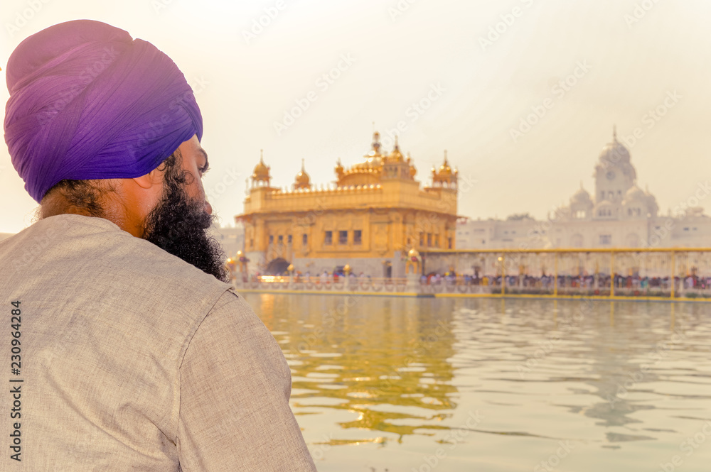Unidentifiable Punjabi Sikh pilgrim devotee "Nihang Warrior" sitting by ...