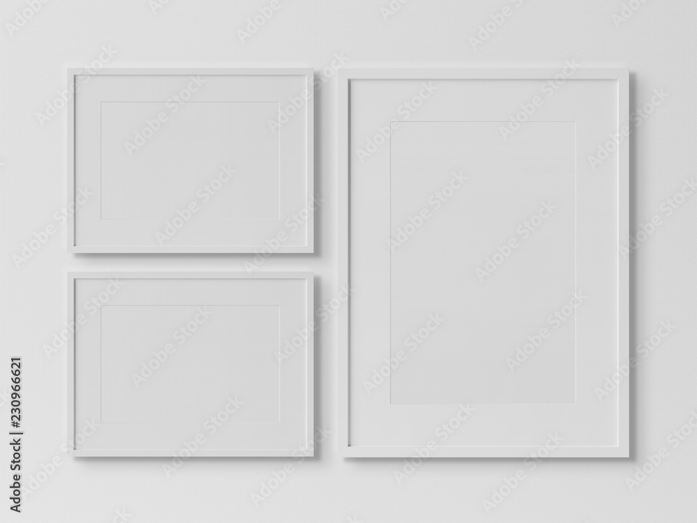 White rectangular frames hanging on a white wall mockup 3D rendering ...