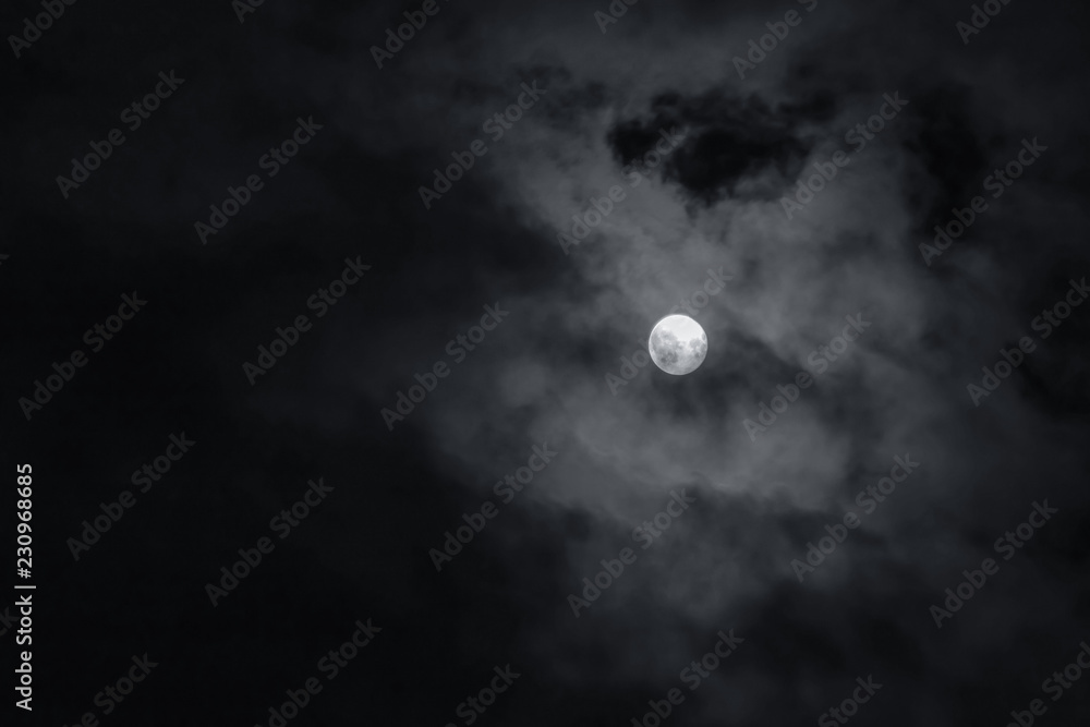 Full moon with dark clouds in the night sky Stock Photo | Adobe Stock