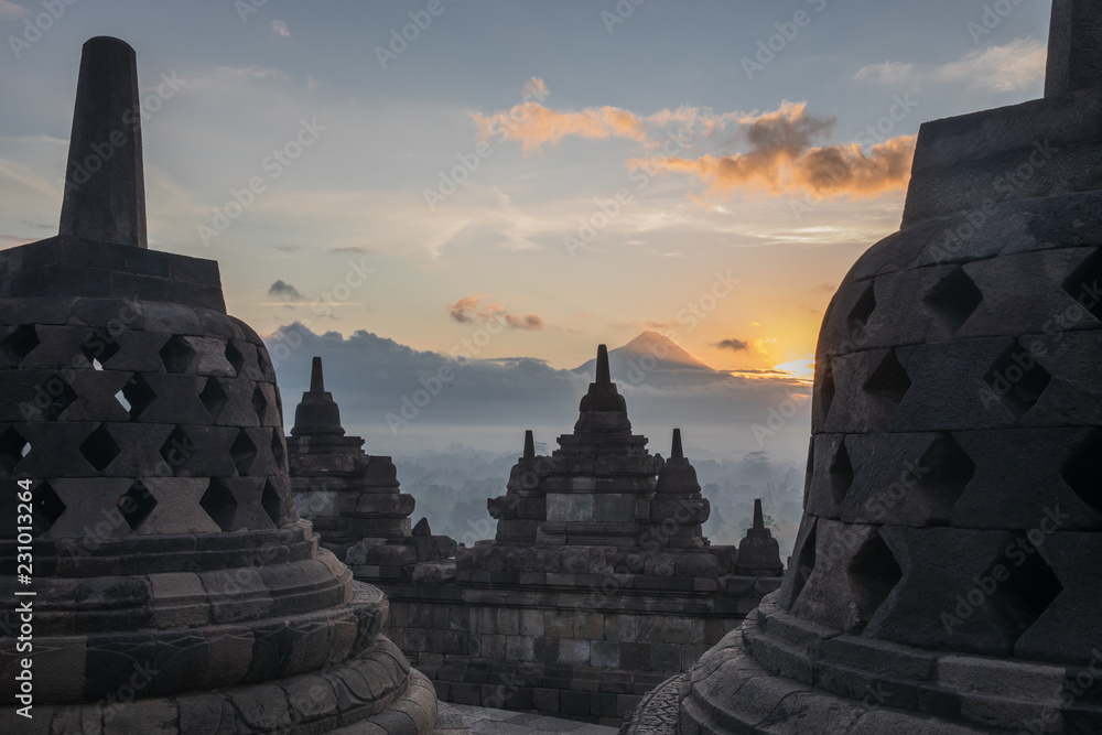 Misty morning and first sunlight from the Borobudur Temple with a view ...