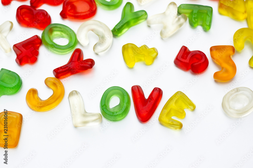 Title made from gummy letters of latin alphabet on white background ...