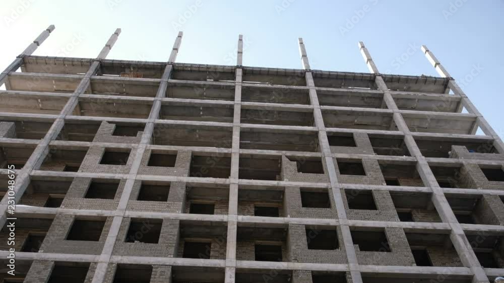 Multi-storey residential building under construction. Front view ...