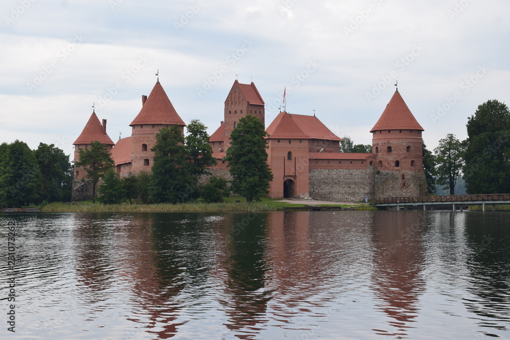 Trakai island castle at the lake. Reflection in water. Stock Photo ...