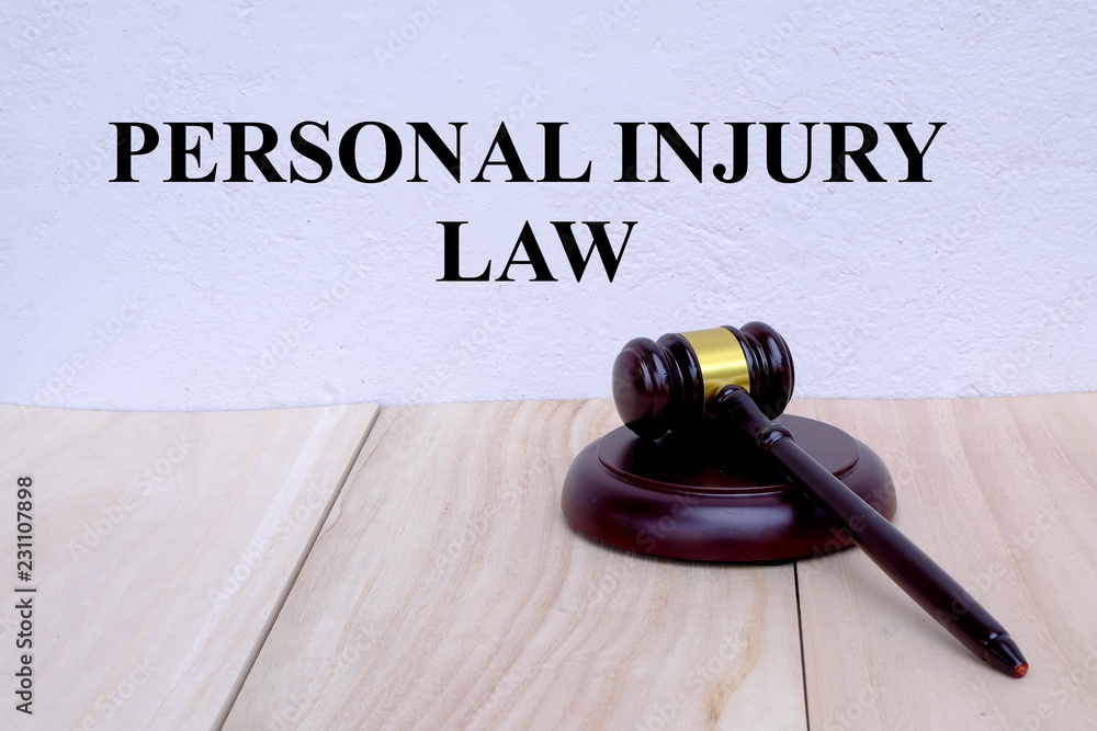 Personal Injury Law written on the wall with gavel on wooden background ...