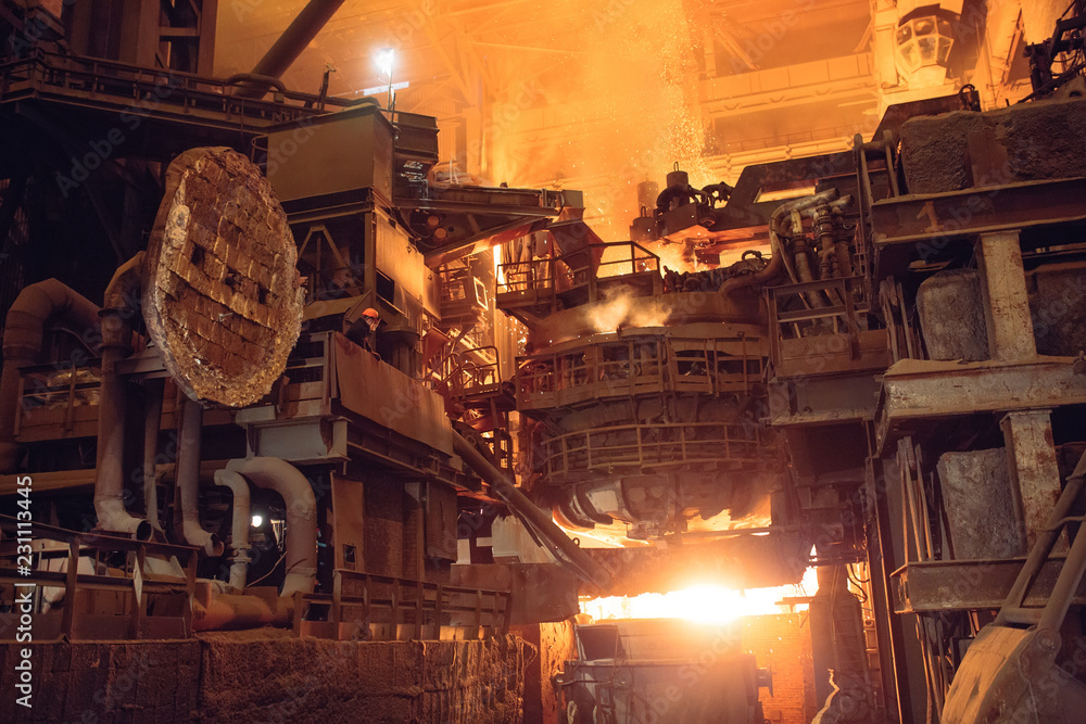 Melting of metal in a steel plant. High temperature in the melting ...
