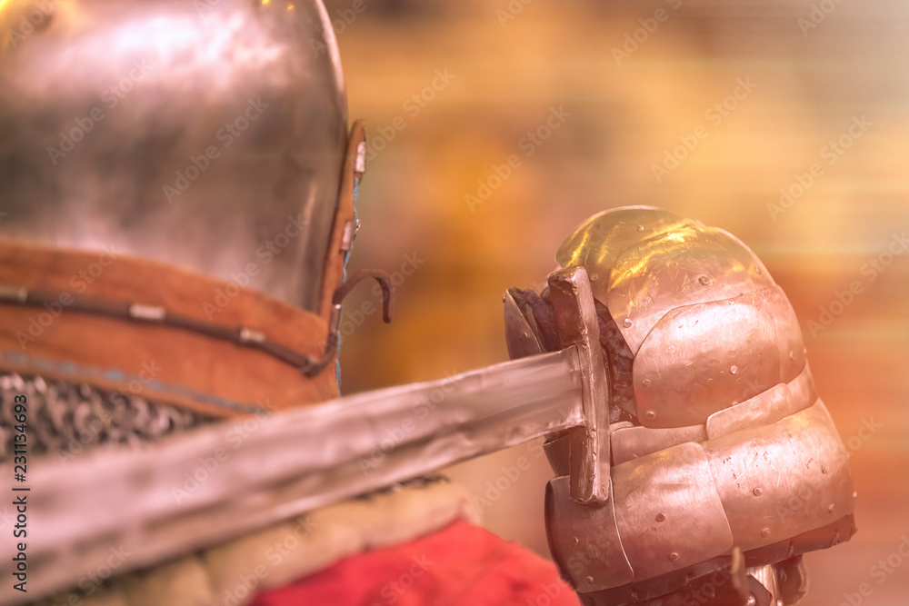 Foto de The man in an iron armor of the soldier in metal a helmet and ...