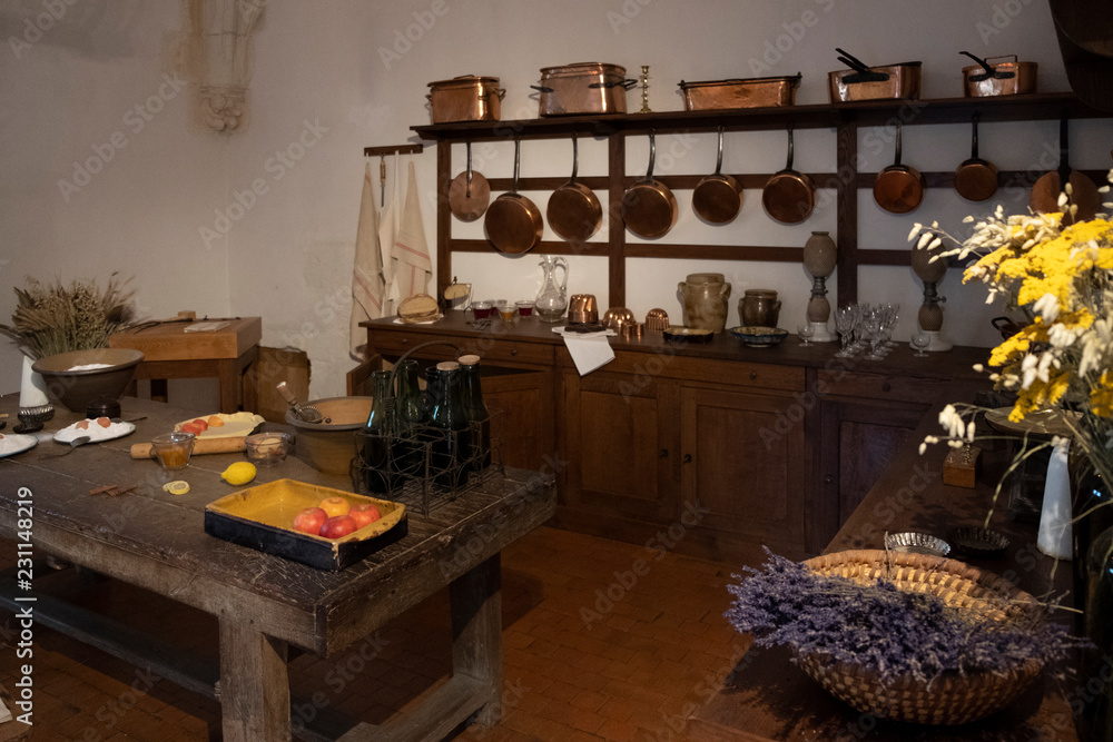 Kitchen in a medieval castle with kitchenware, furniture and food on ...
