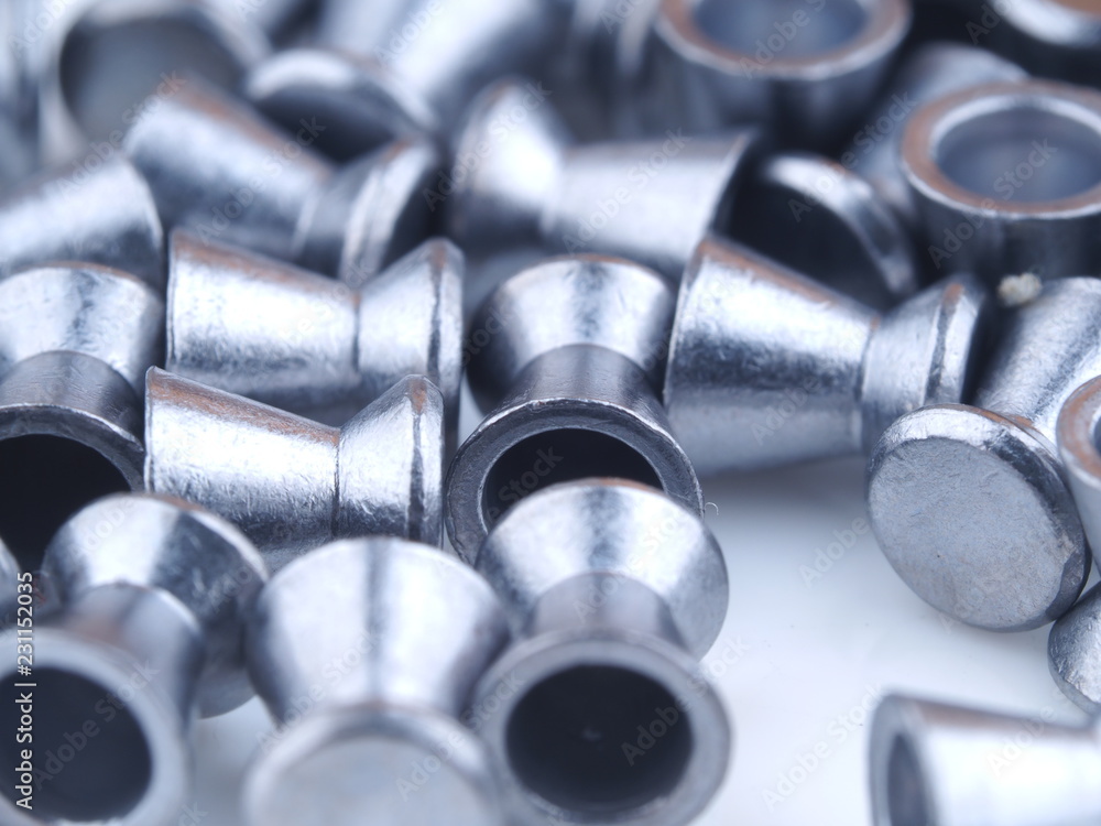bullets for a pneumatic gun on a white background Stock Photo | Adobe Stock