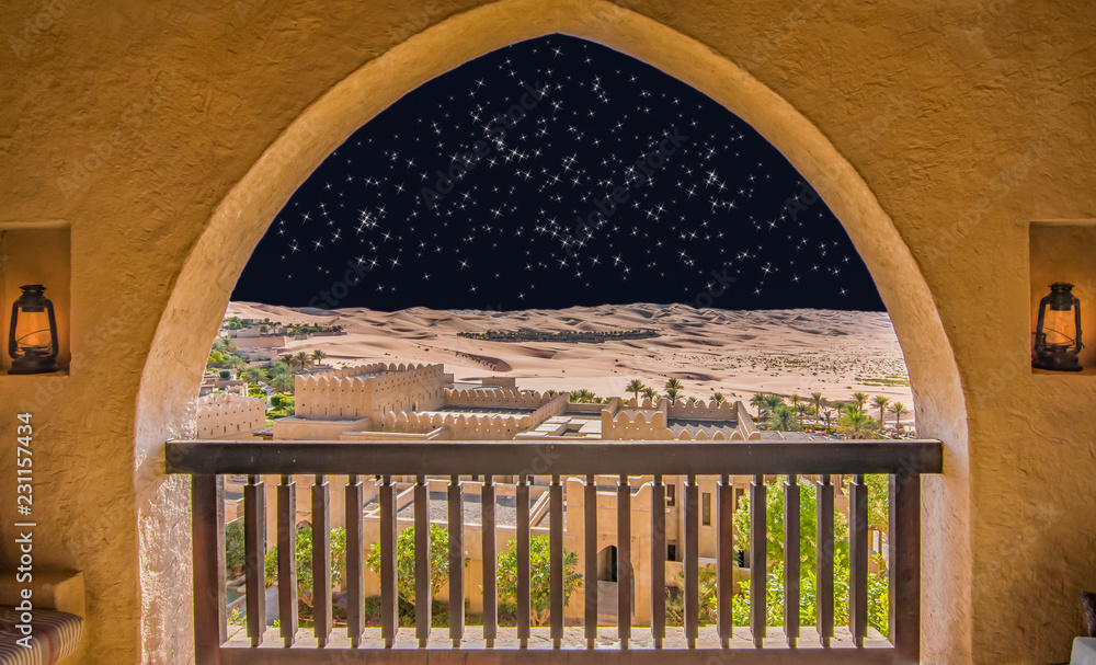 Arabic architecture. Balcony overlooking the desert and a night sky ...