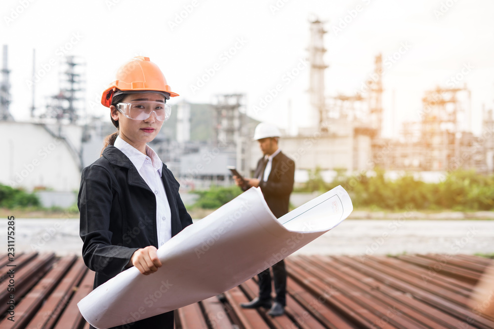 Engineer worker Concept working at oil refinery. Young Asian women ...