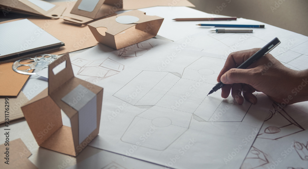 Designer sketching drawing design Brown craft cardboard paper product ...