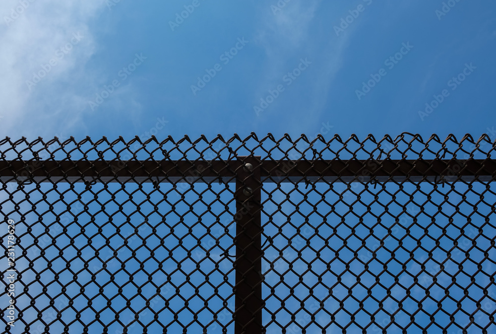 Isolated chain link fence. Moody cloud background. Minimal street ...