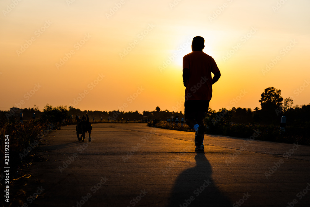 Silhouette man running on sunset background Stock Photo | Adobe Stock