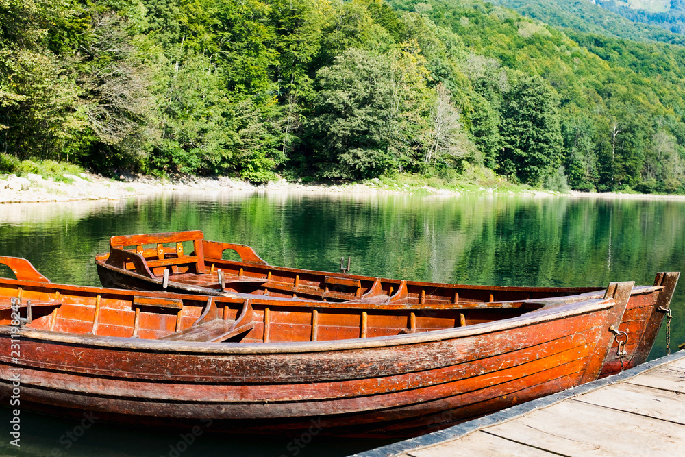 Beautiful view of traditional wooden rowing boats on scenic lake Wherry ...