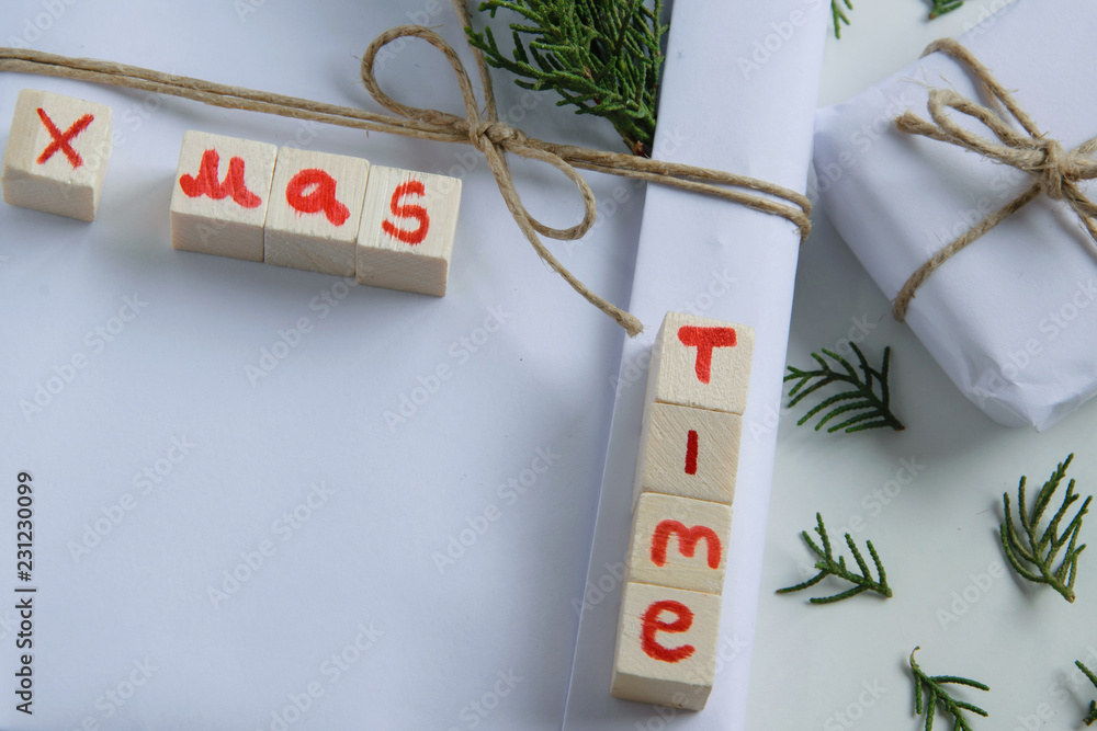 Top view of white handcraft gift boxes with "X mas time" text (wooden ...