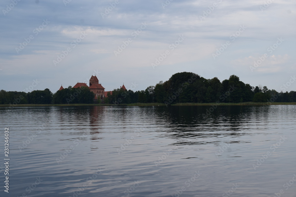 Trakai island castle at the lake. Reflection in water. Stock Photo ...