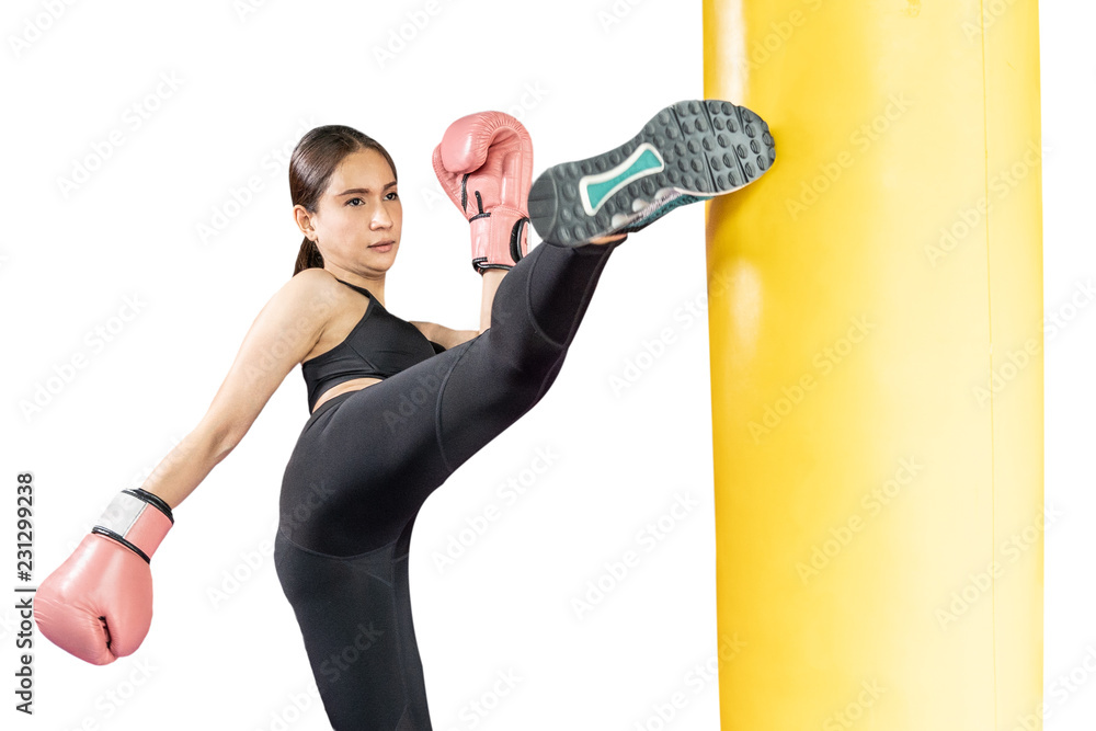 Female boxer hitting a huge punching bag at a boxing studio. Woman ...