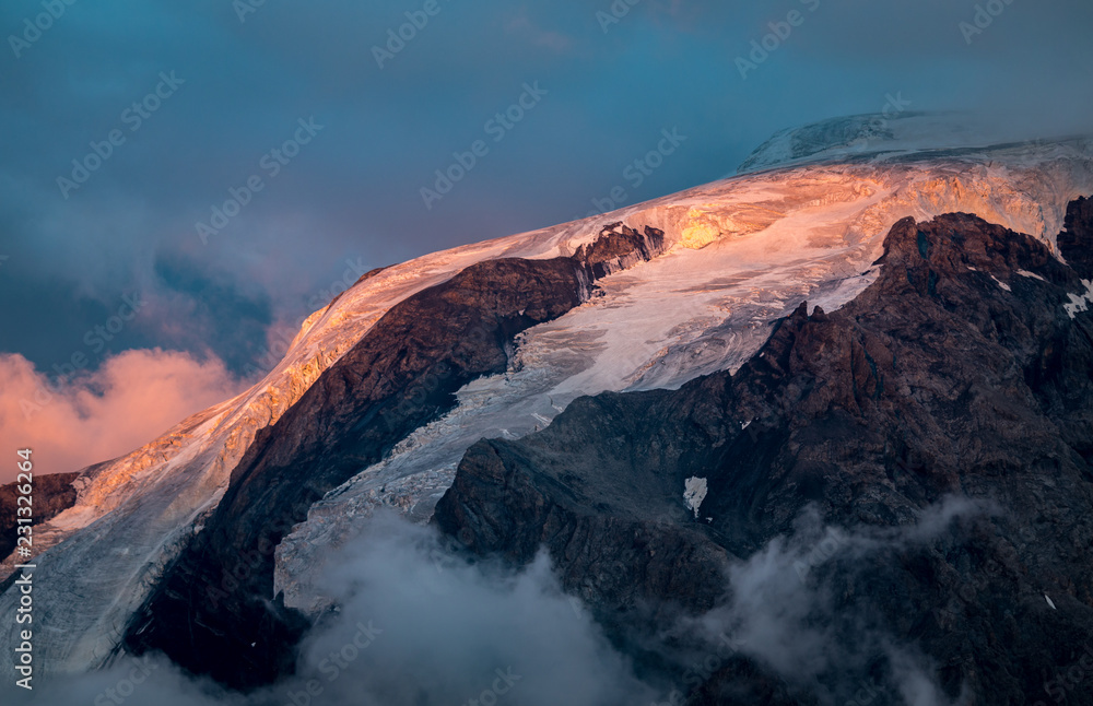 View on Mount Ortler with glacier and clouds at sunset, Passo del ...