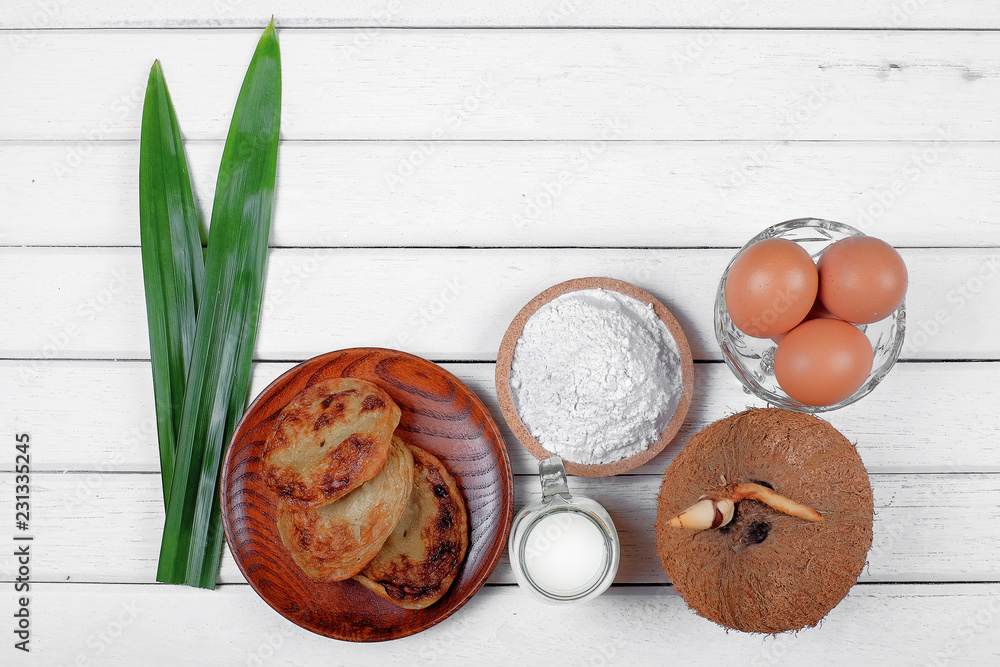 Akok Kedut, egg, coconut, flour , coconut milk and Pandan leaf on ...