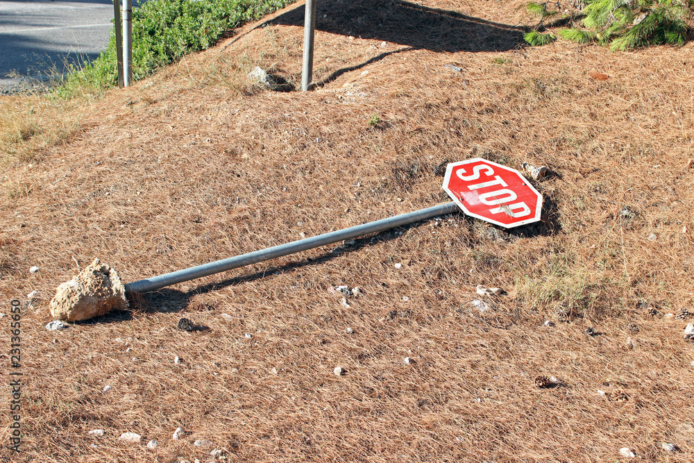 Broken stop traffic sign on the ground concrete base horizontal Stock ...
