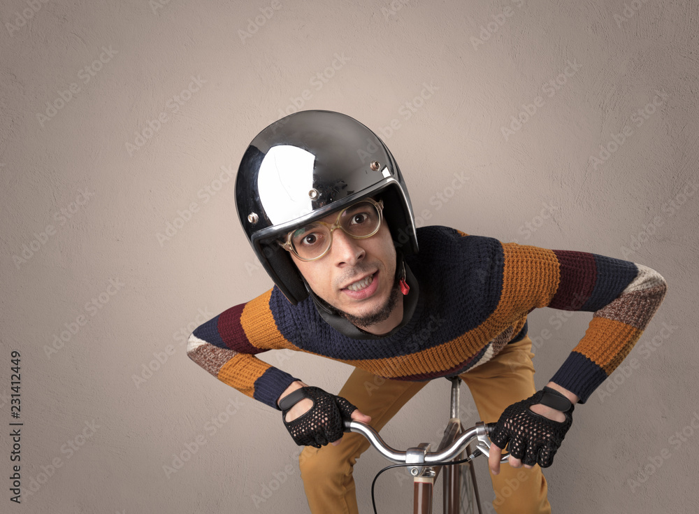 Nerd young foolish biker on a bike with oldschool outfit Stock Photo ...