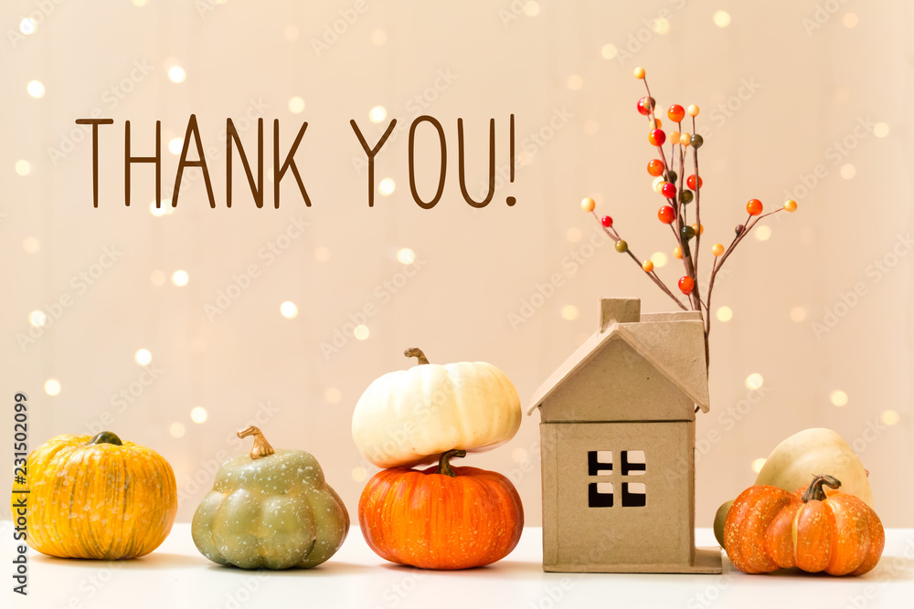 Thank you message with collection of autumn pumpkins with a toy house ...