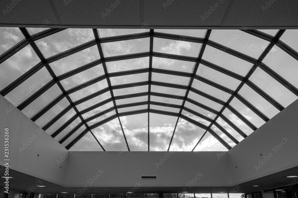 Modern glass roof with steel grid frames. Skylight rooftop window with ...