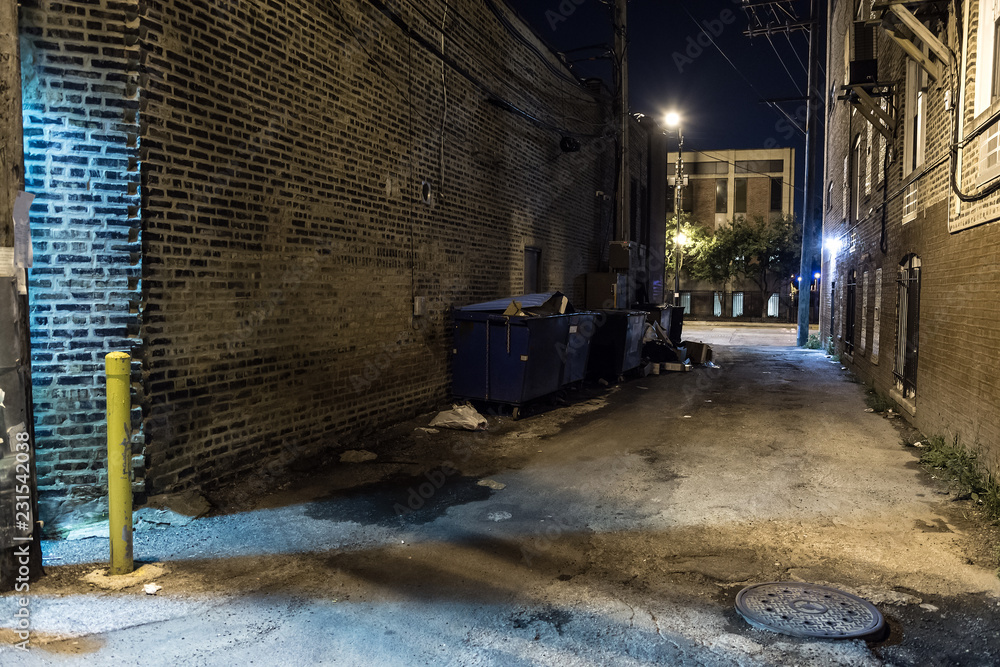 Dark and scary downtown urban city street corner alley with an eerie ...