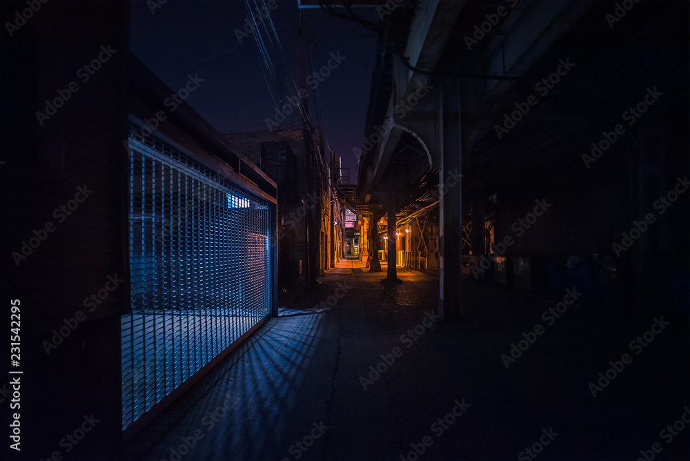 Dark and scary downtown urban city street alley under an eerie vintage ...