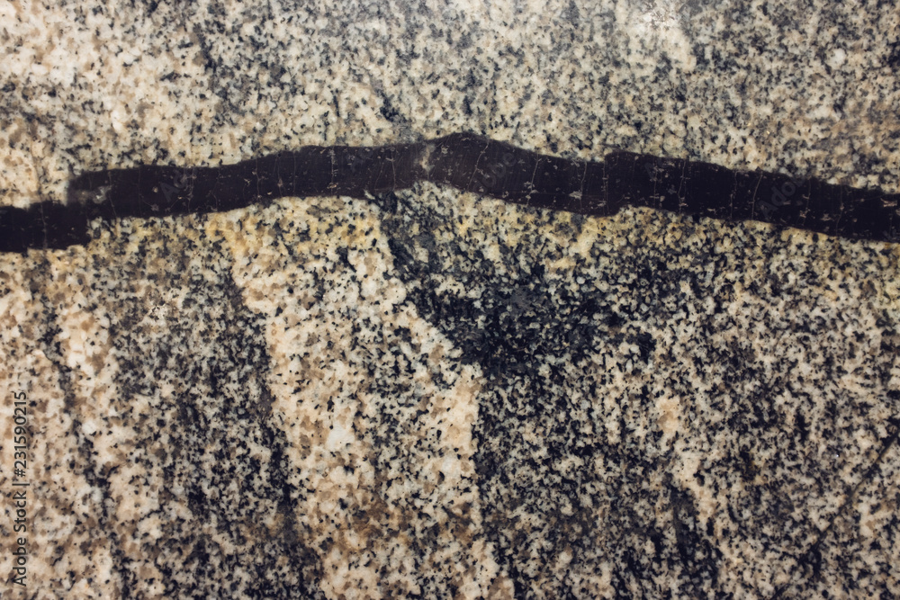 Abstract granite texture with solid black snake-like seam Stock Photo ...