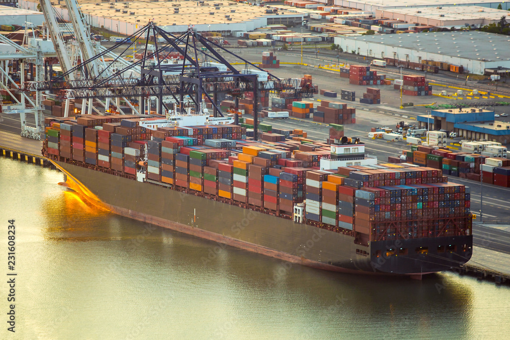 Container ship docked at sea port with cargo Stock Photo | Adobe Stock